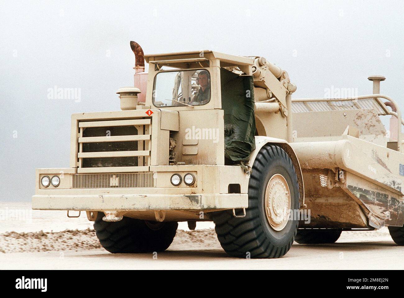 A Seabee assigned to Naval Mobile Construction Battalion Five (NMCB-5 ...