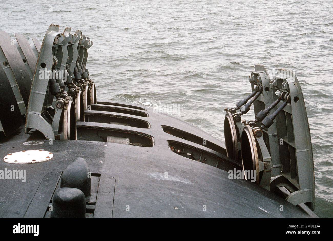 A view of the open hatches of six of the 12 vertical-launch Tomahawk ...