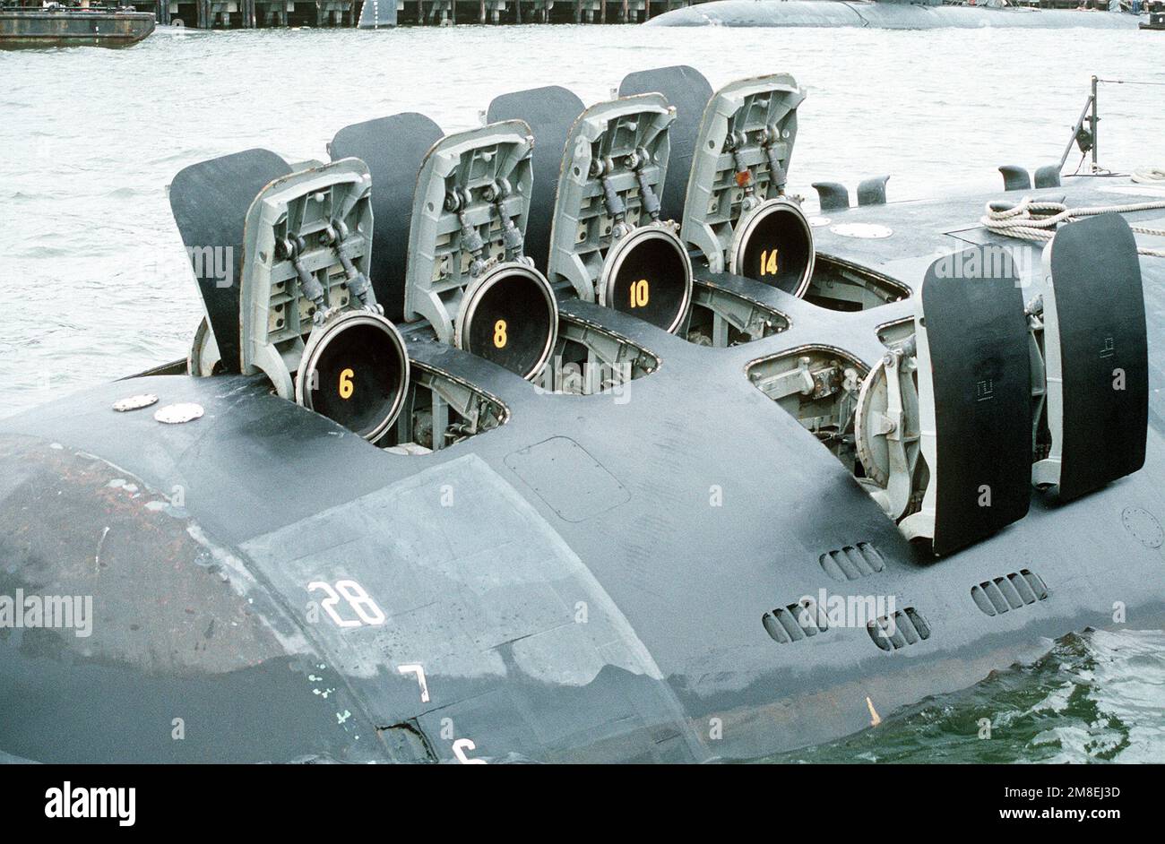 The hatches of the 12 vertical-launch Tomahawk missile tubes stand open ...