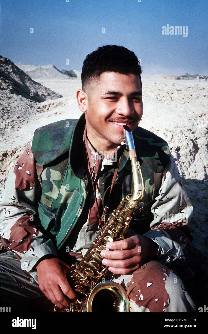 Lance CPL. Keith Dorsett, a Marine reservist, plays his saxophone while ...