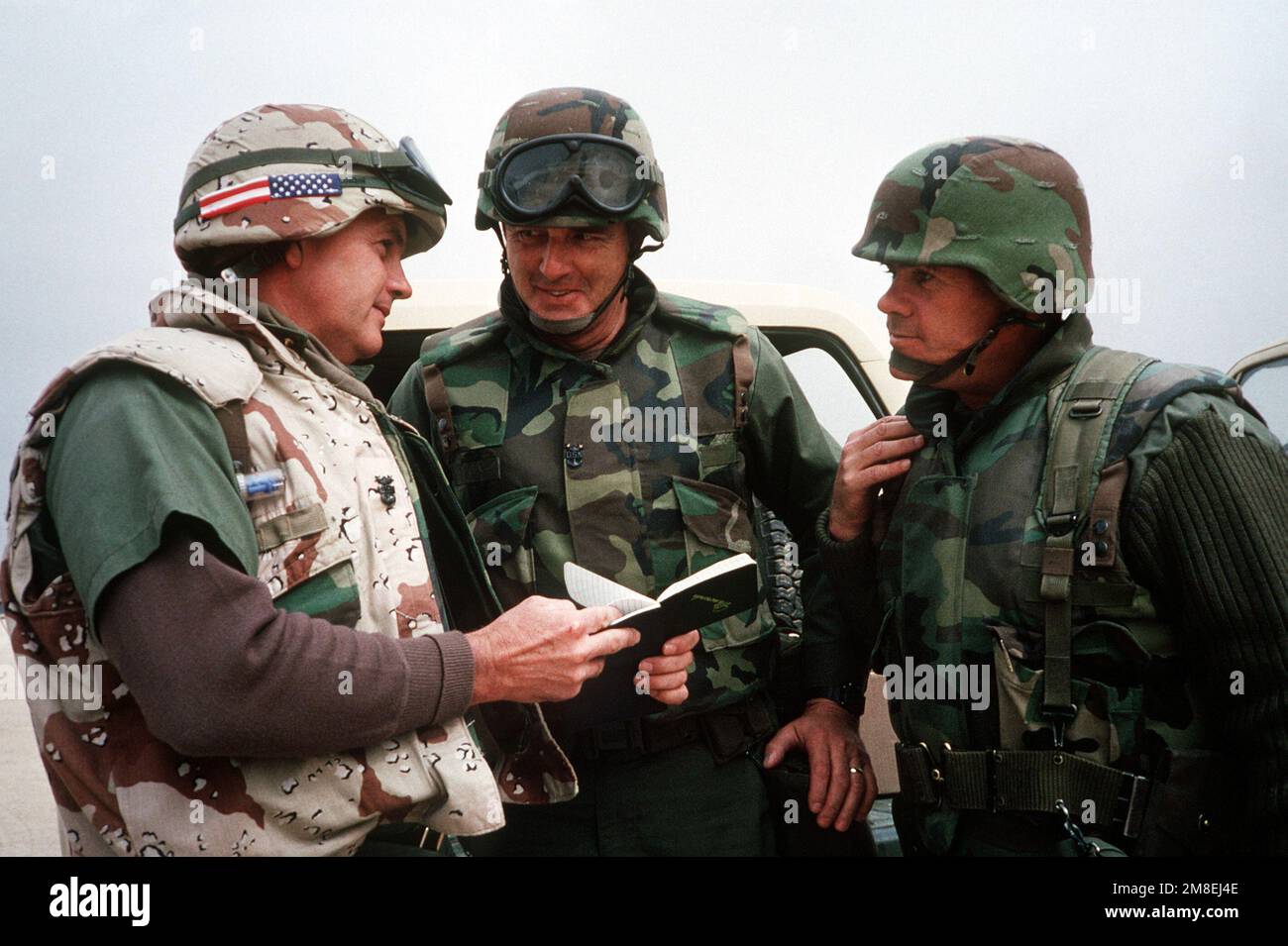 Three chief petty officers from a naval mobile construction battalion ...