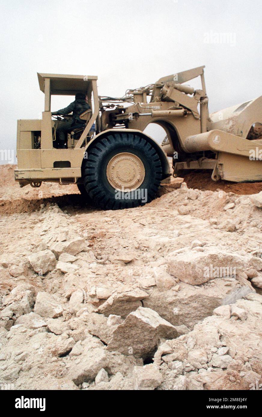 A Seabee assigned to Naval Mobile Construction Battalion Five (NMCB-5 ...