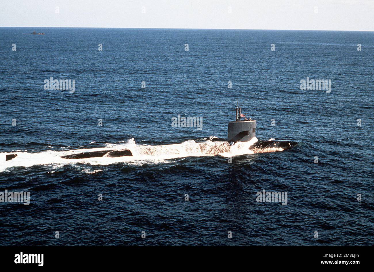 A starboard view of the nuclear-powered attack submarine USS ...