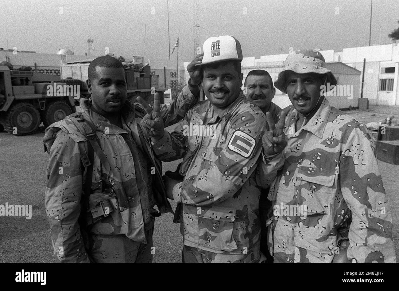 Marine MASTER SGT. Thomas C. Wilson, left, places a cap on the head of ...