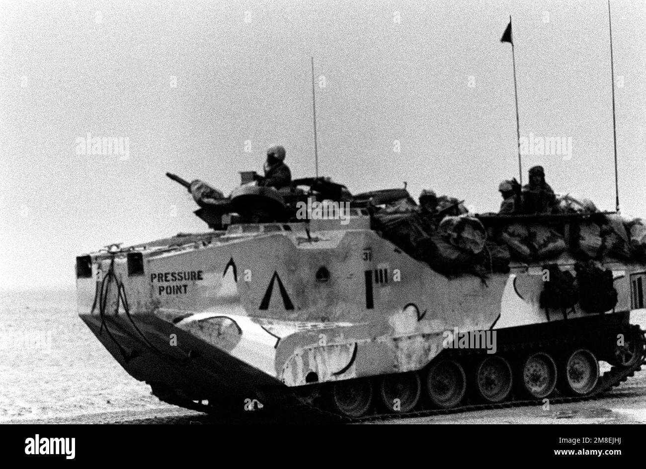 A Marine Corps AAVP-7A1 amphibious assault vehicle crosses into Kuwait ...