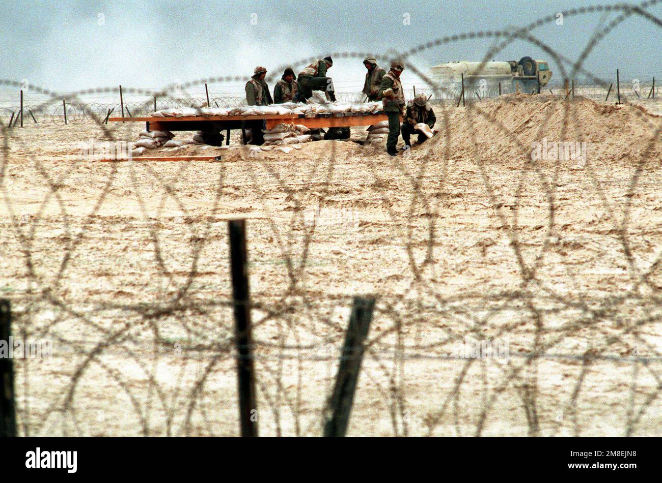 Seabees from Naval Mobile Construction Battalion 5 (NMCB-5) fill ...