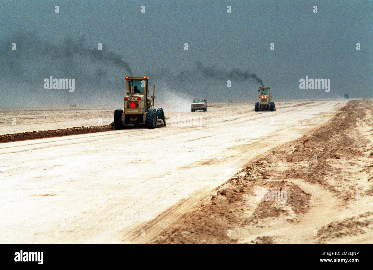 Two Naval Mobile Construction Battalion 5 (NMCB-5) motor graders are ...