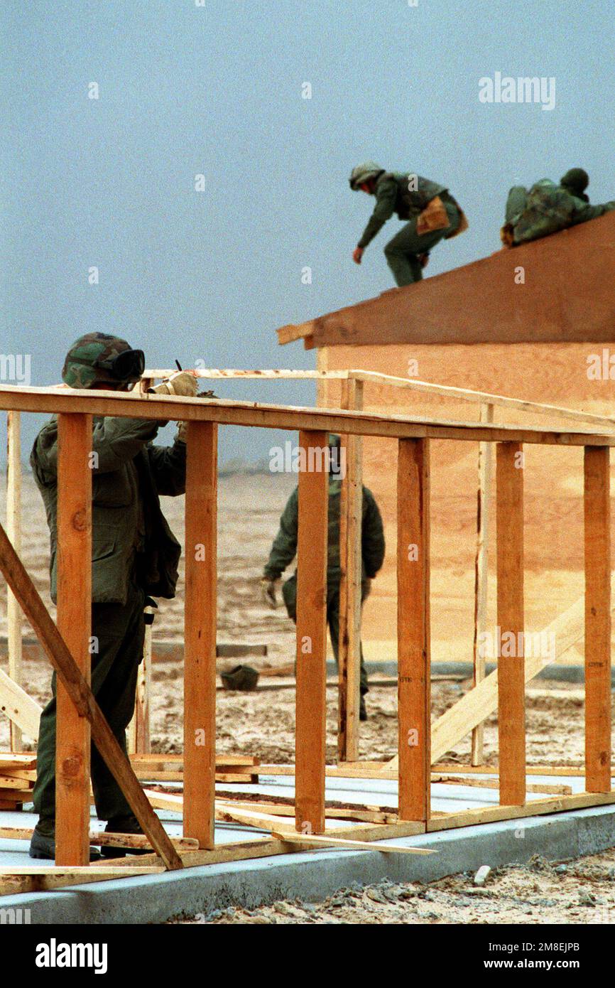 A Seabee from Naval Mobile Construction Battalion 5 (NMCB-5) works on ...