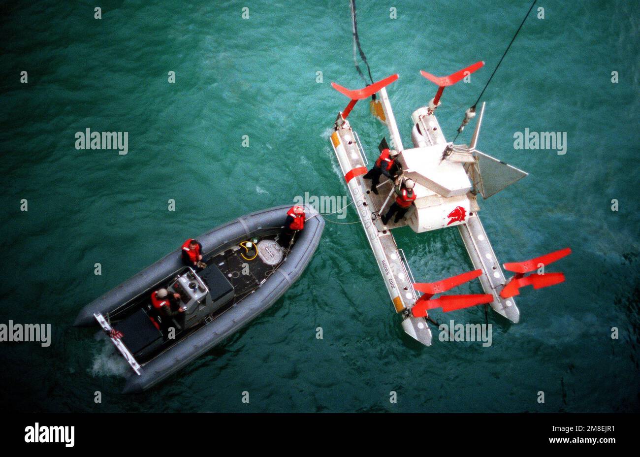 After hooking up a towing cable from a helicopter to a Mark 105 ...