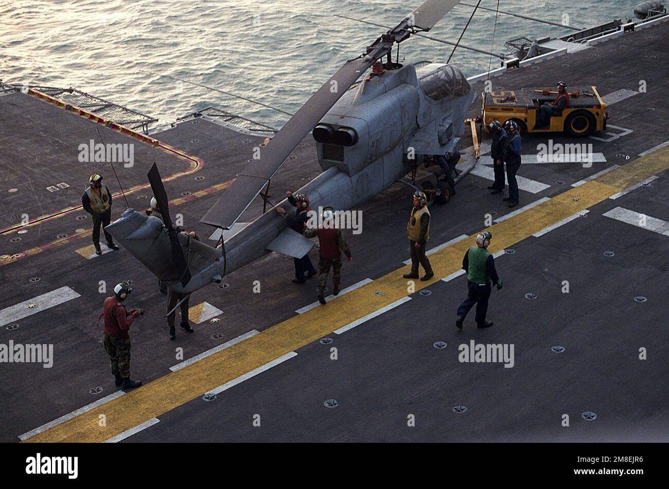 Flight deck crewmen aboard the amphibious assault ship USS NEW ORLEANS ...