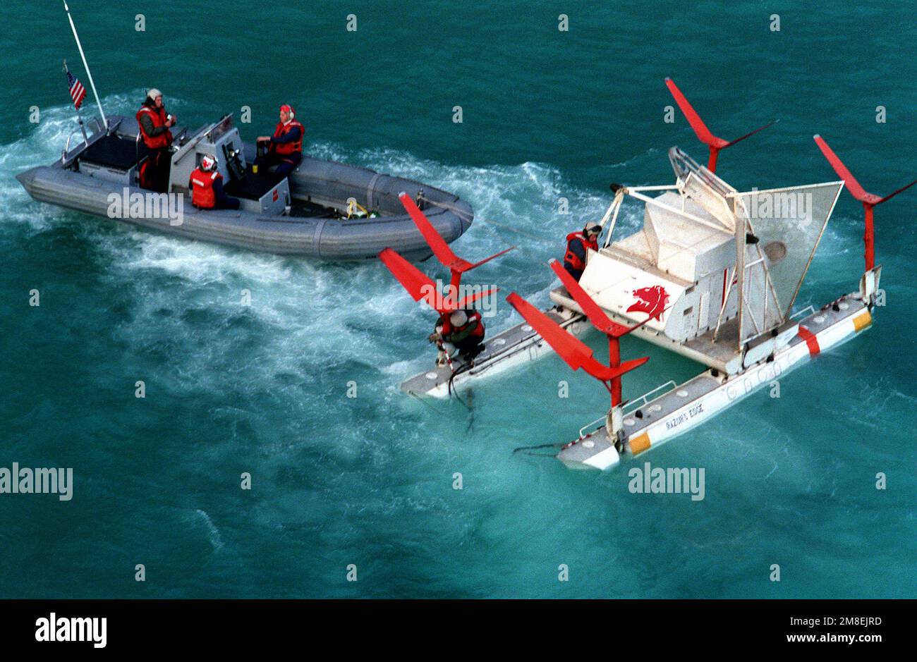 Three members of Helicopter Mine Countermeasures Squadron 14 (HM-14 ...