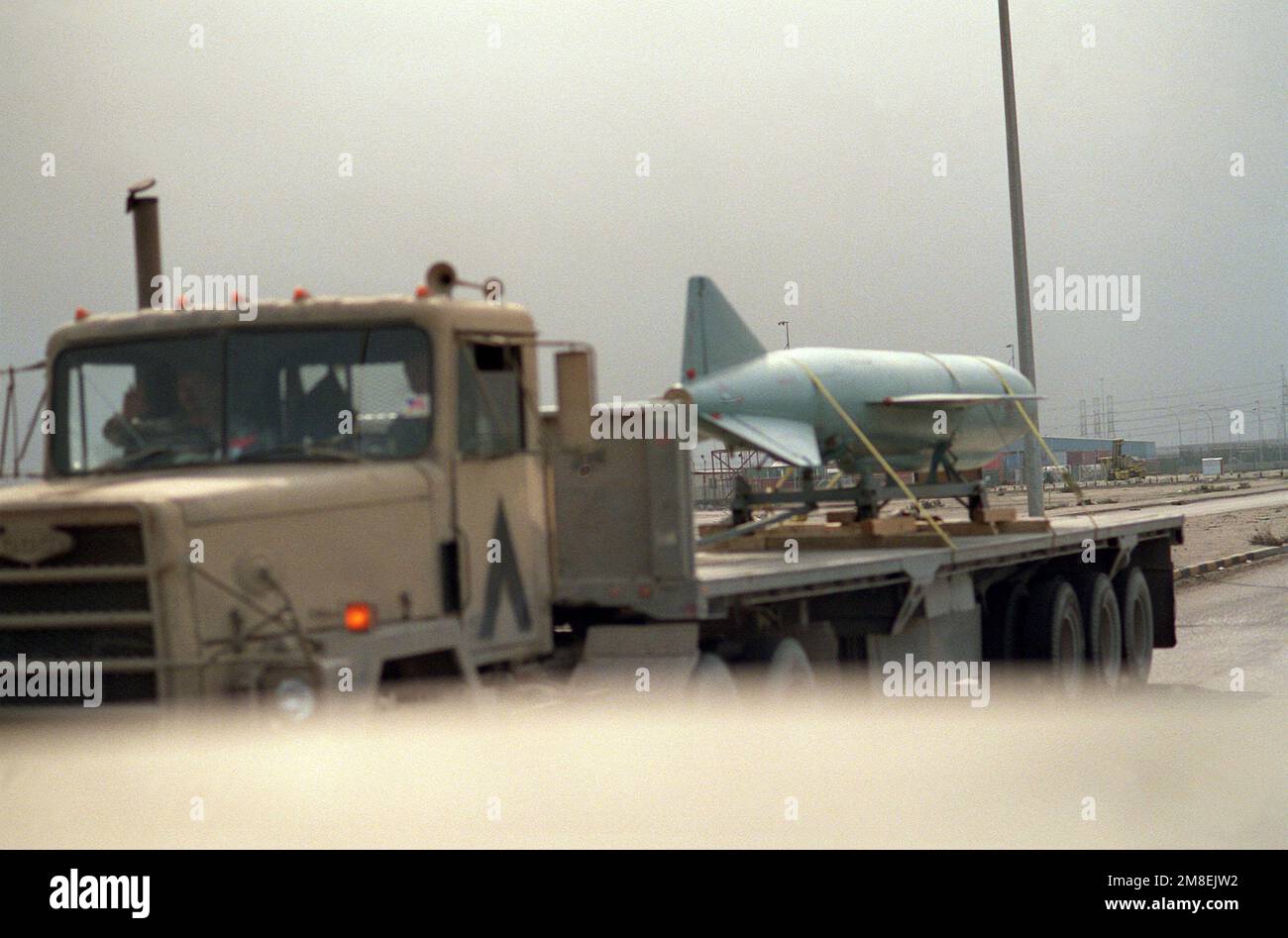 A captured Iraqi CSS-N-2 Silkworm anti-ship missile is carried on a ...