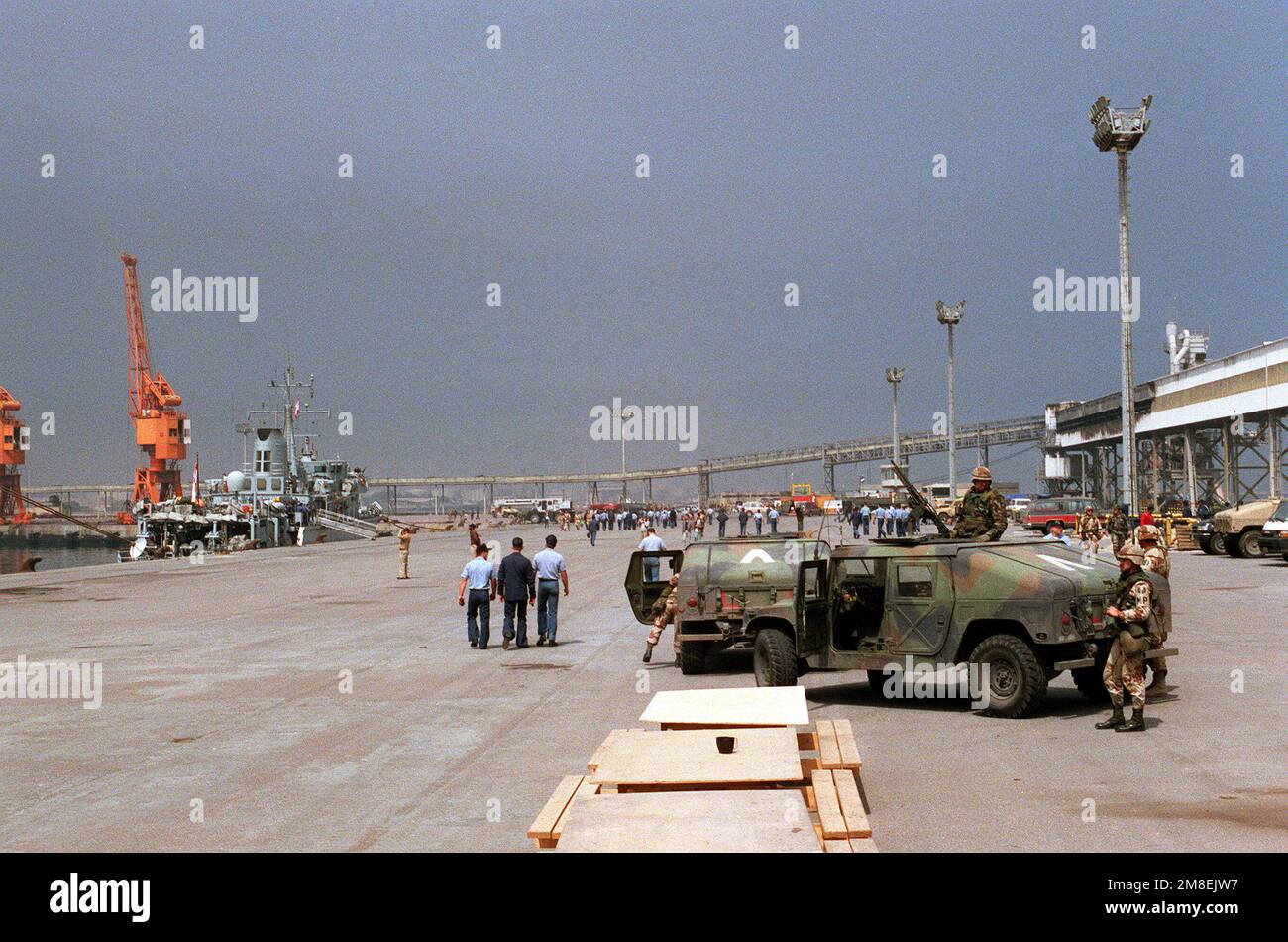 U.S. military policemen stand by beside their M998 as High-Mobility ...