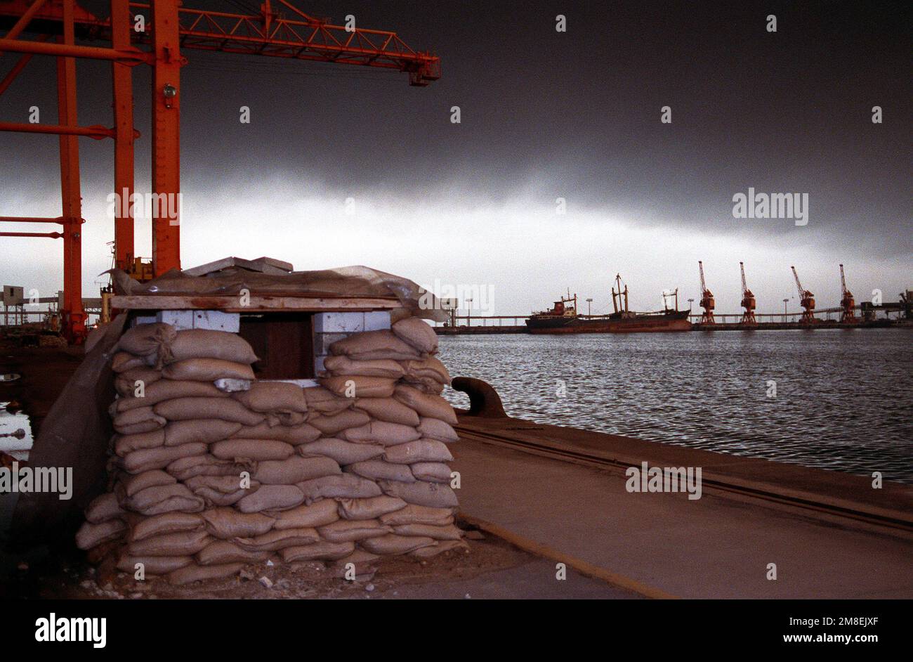 A former Iraqi defensive emplacement sits on a dock at the city's port ...
