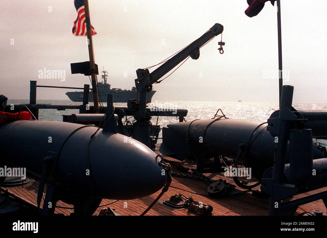 Two minesweeping floats sit in their cradles on the stern of the ocean ...