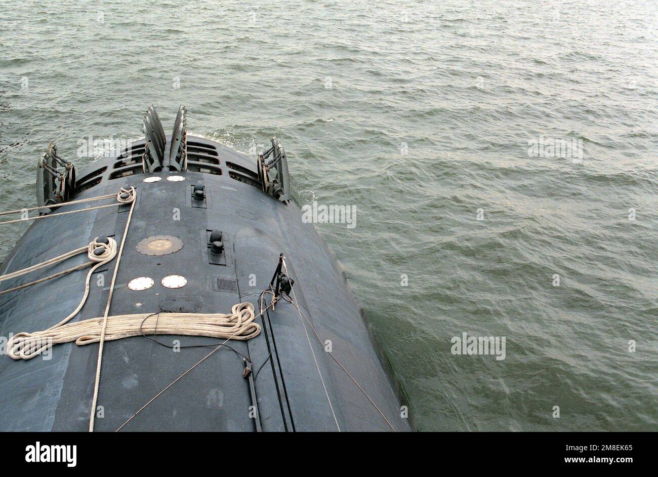 The hatches of the 12 vertical-launch Tomahawk missile tubes stand open ...
