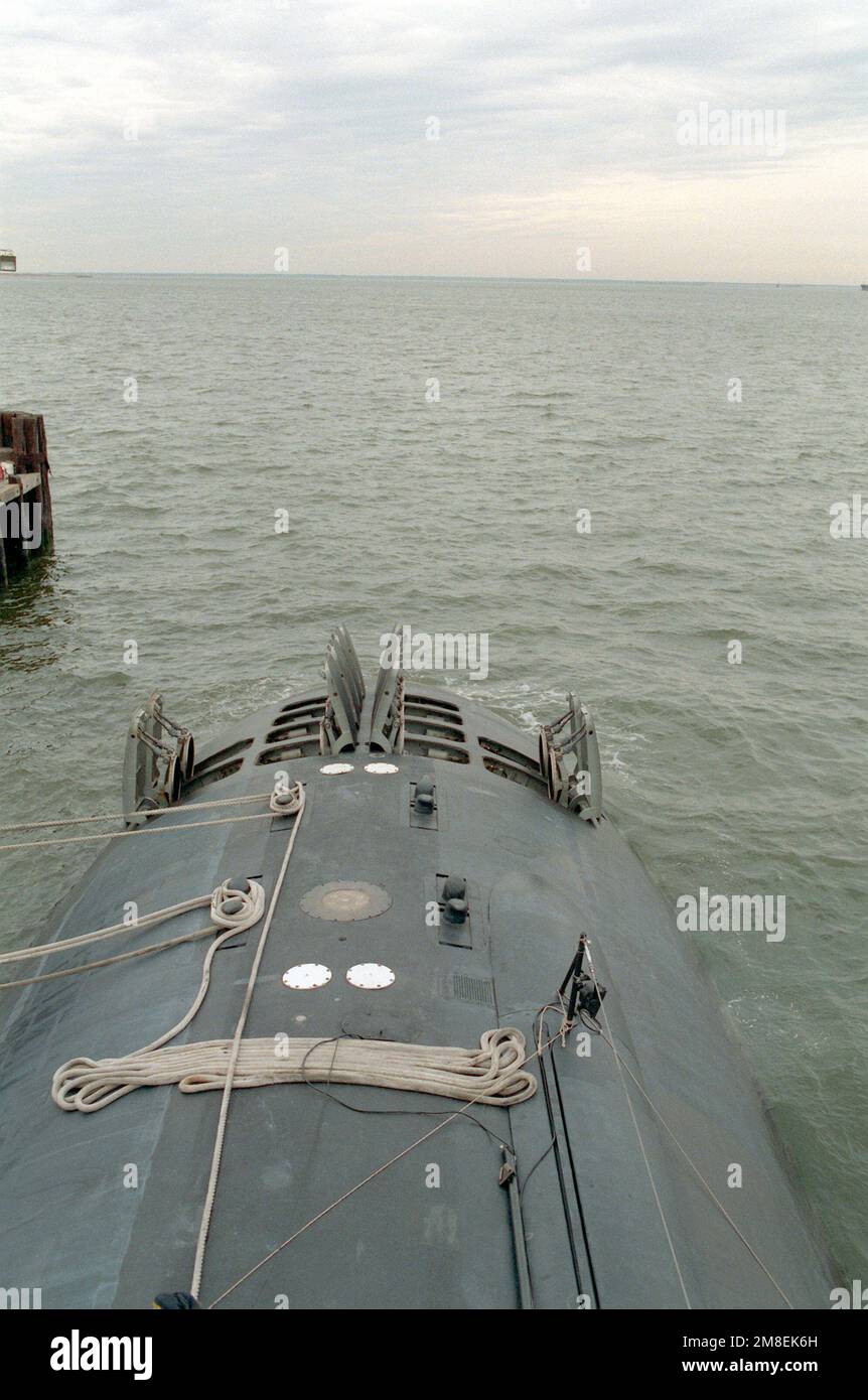 The hatches of the 12 vertical-launch Tomahawk missile tubes stand open ...