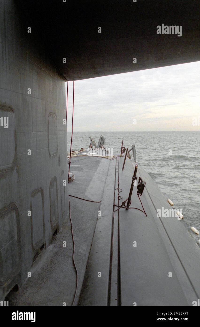 The hatches of the 12 vertical-launch Tomahawk missile tubes stand open ...