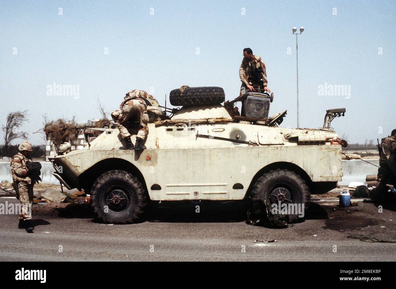 American servicemen examine an Iraqi BRDM-2 amphibious scout car ...