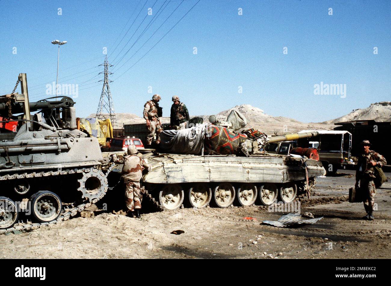 American servicemen prepare to use an M-88A1 armored recovery vehicle ...