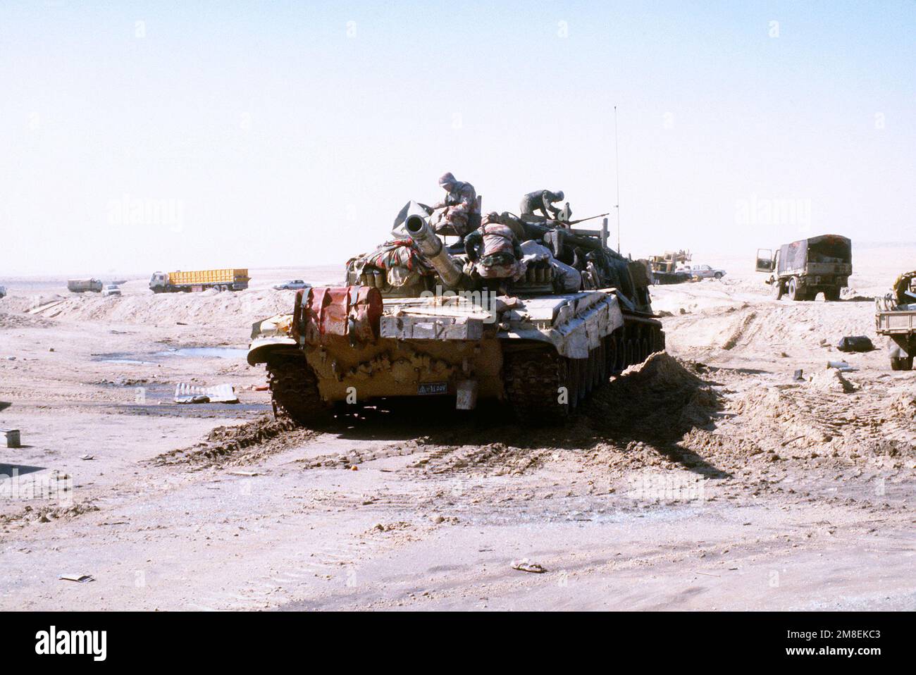 American servicemen check over an Iraqi T-72 main battle tank that was ...