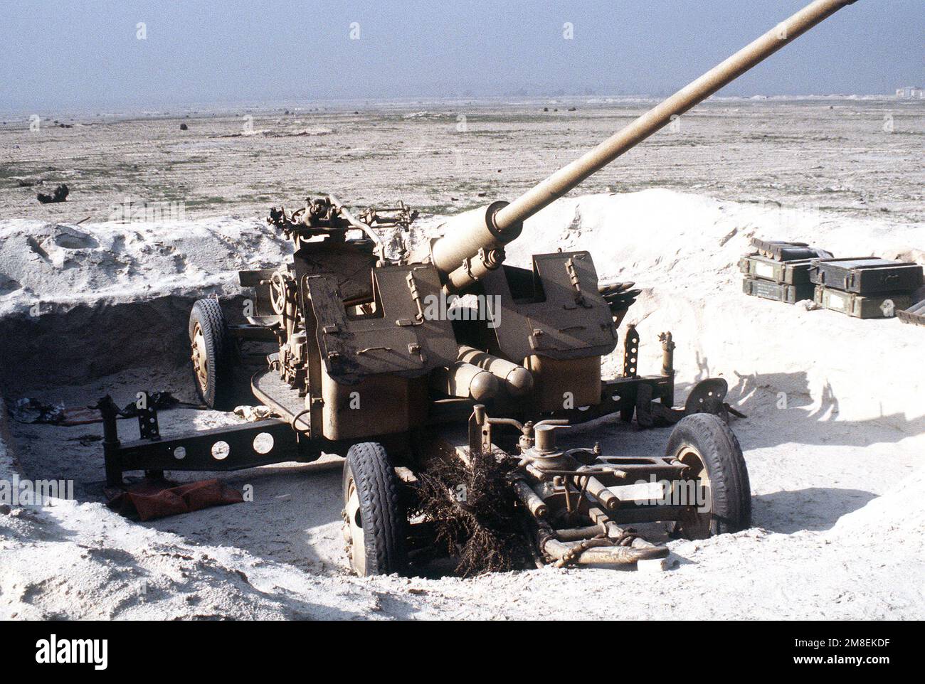 Cases of ammunition lie next to an Iraqi S-60 57mm automatic anti ...