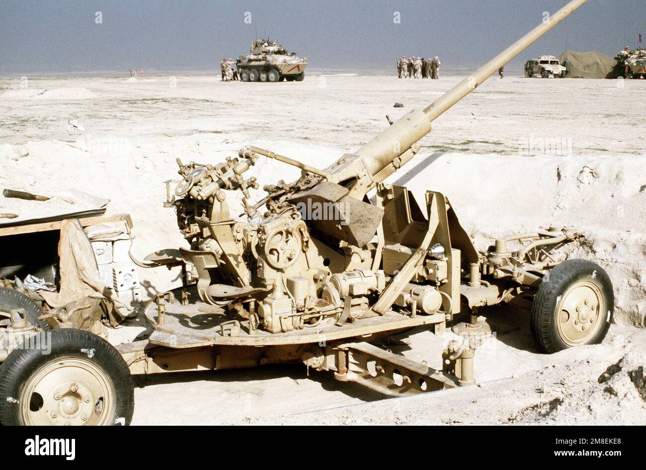 An Iraqi S-60 57mm automatic anti-aircraft gun sits in its emplacement ...
