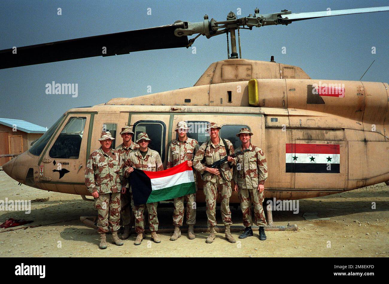 Members of the staff of the 3rd Marine Aircraft Wing (3rd MAW) stand in ...