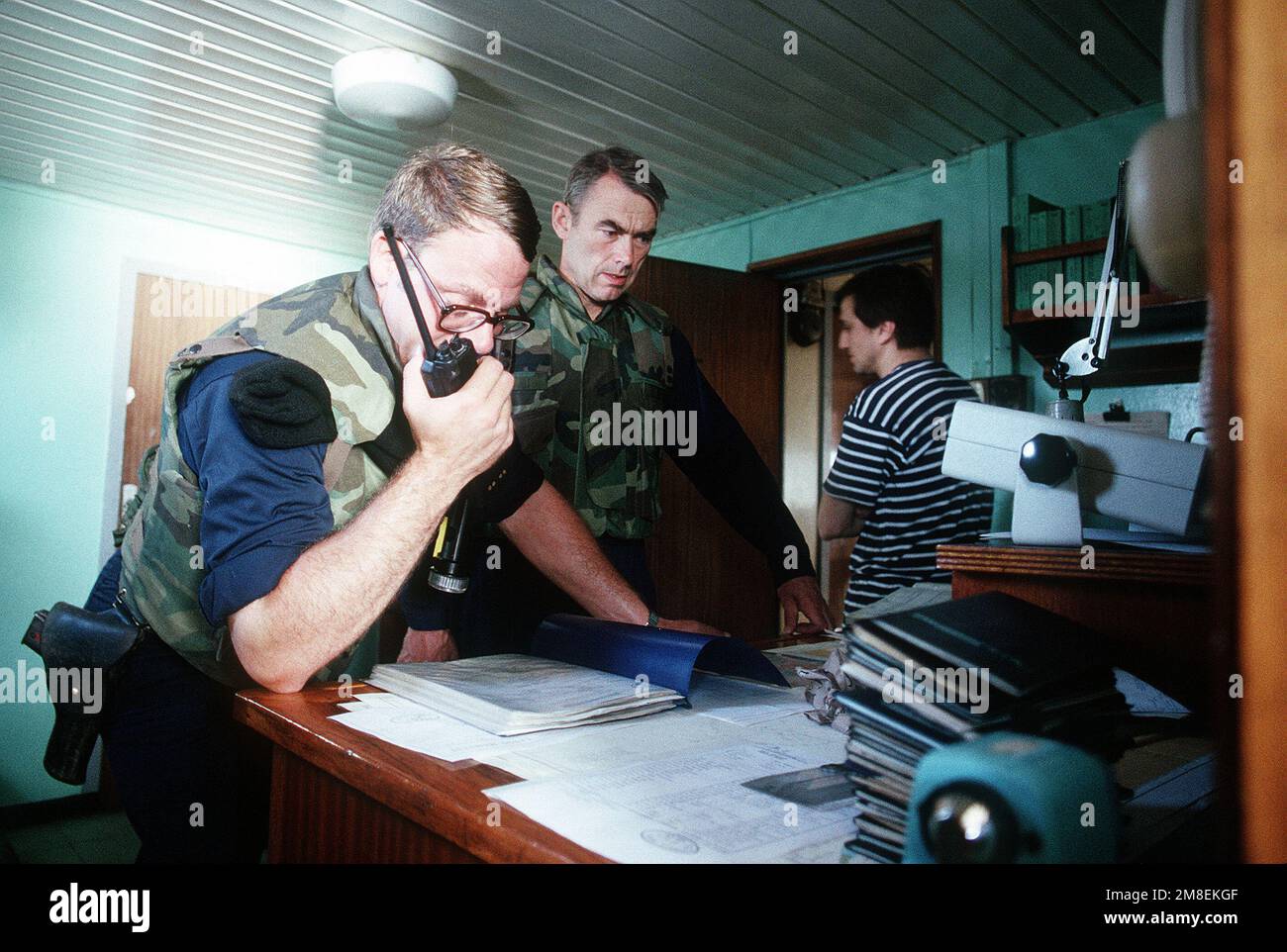 CAPT. Douglas C. Bauer, a Navy combat artist/historian, observes ...