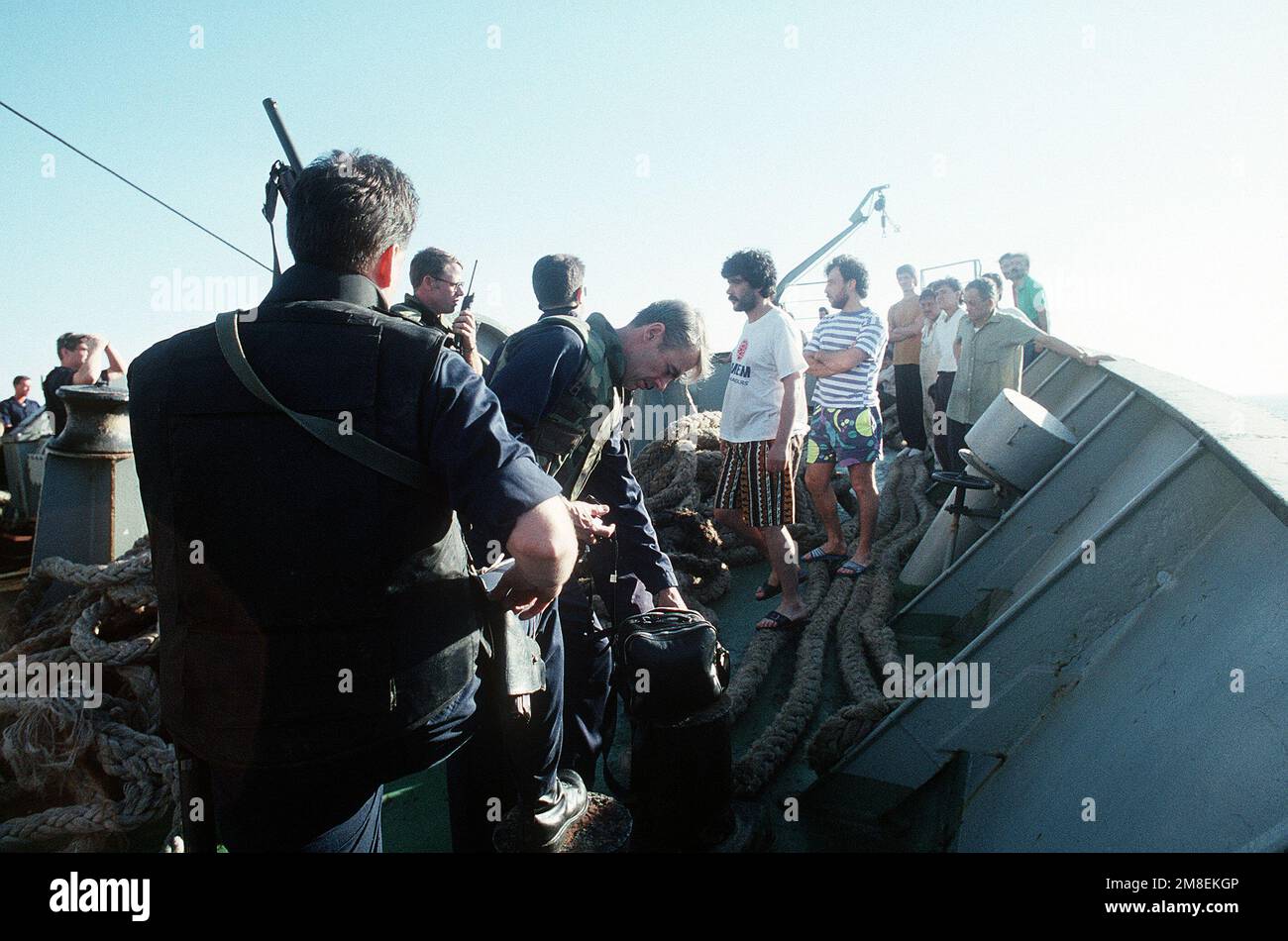 Members of a boarding party from the guided missile destroyer USS ...