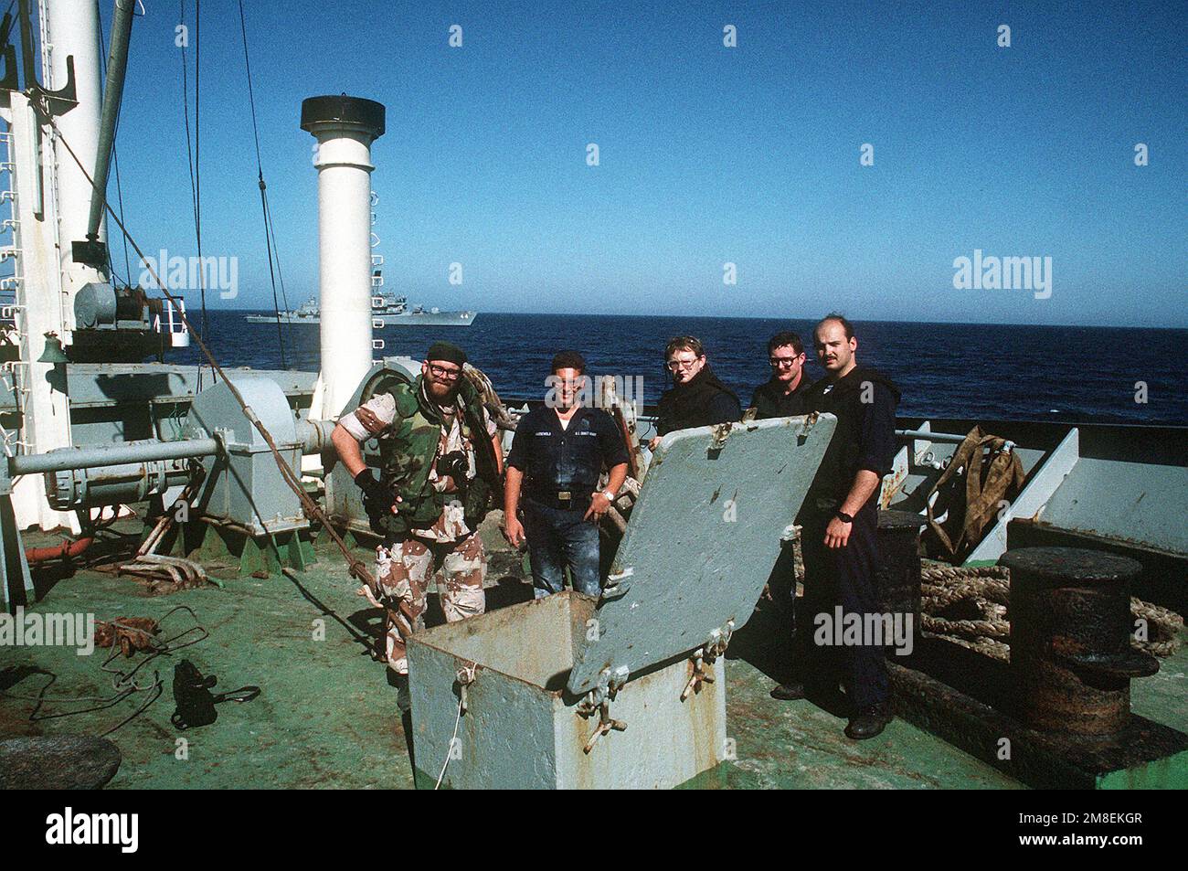Photographer's Mate 2nd Class Milton Savage, USNR-R, poses for a ...