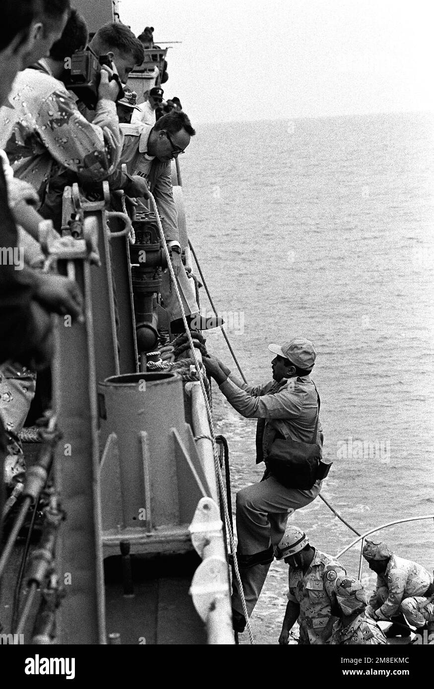 A Saudi Arabian harbor pilot comes aboard the battleship USS MISSOURI ...