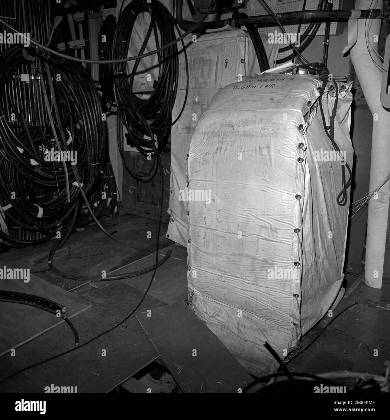 The interior communications and gyro room No. 1 aboard the guided ...
