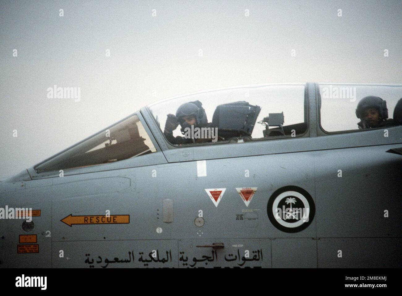 The pilot and weapons officer of a Saudi Arabian Tornado aircraft look ...