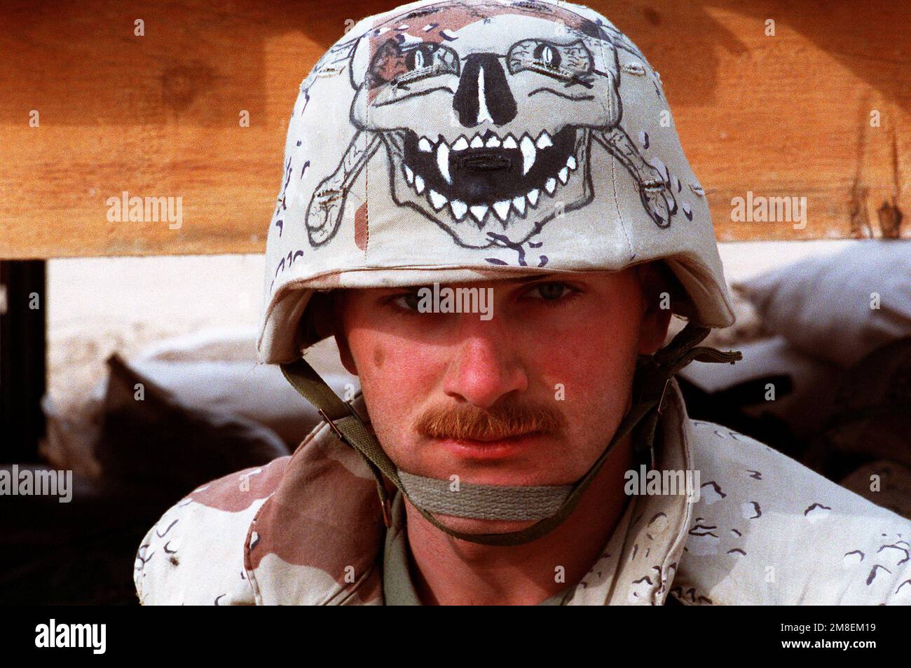 A Seabee from Naval Mobile Construction Battalion 5 (NMCB -5) displays ...