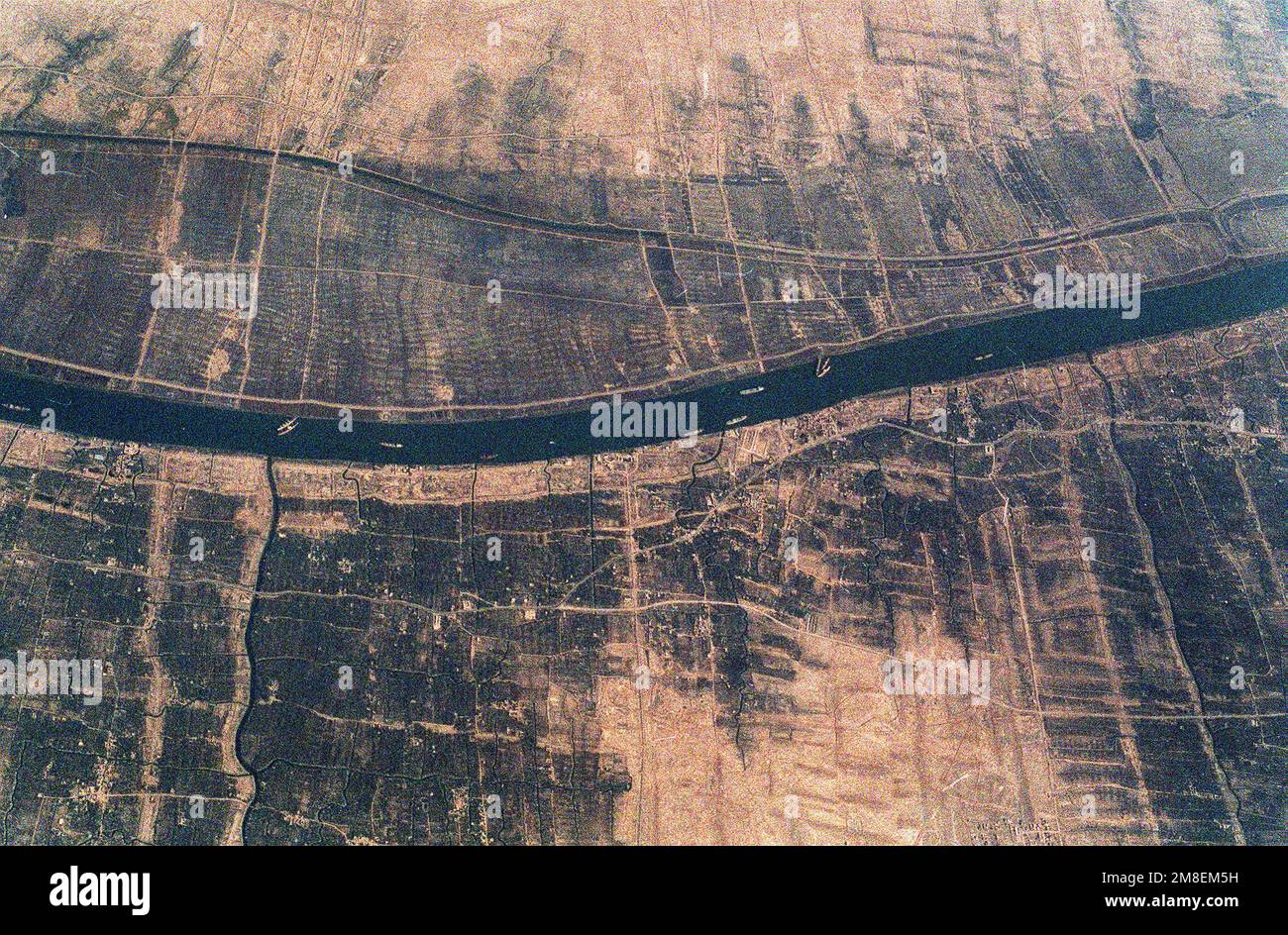 Disabled Iraqi ships block portions of a waterway during Operation ...