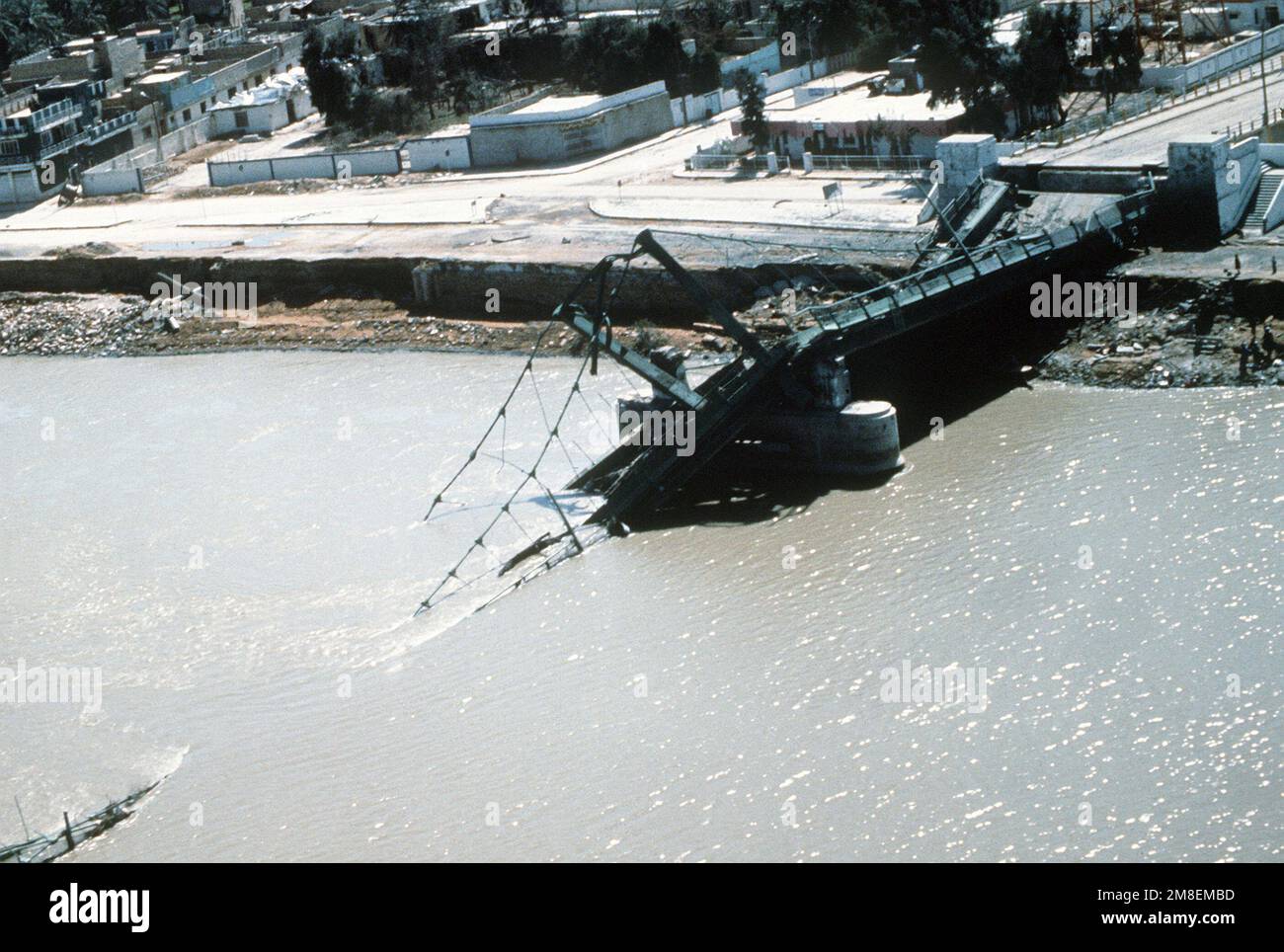 A bridge is collapsed in the aftermath of Allied bombing attacks during ...