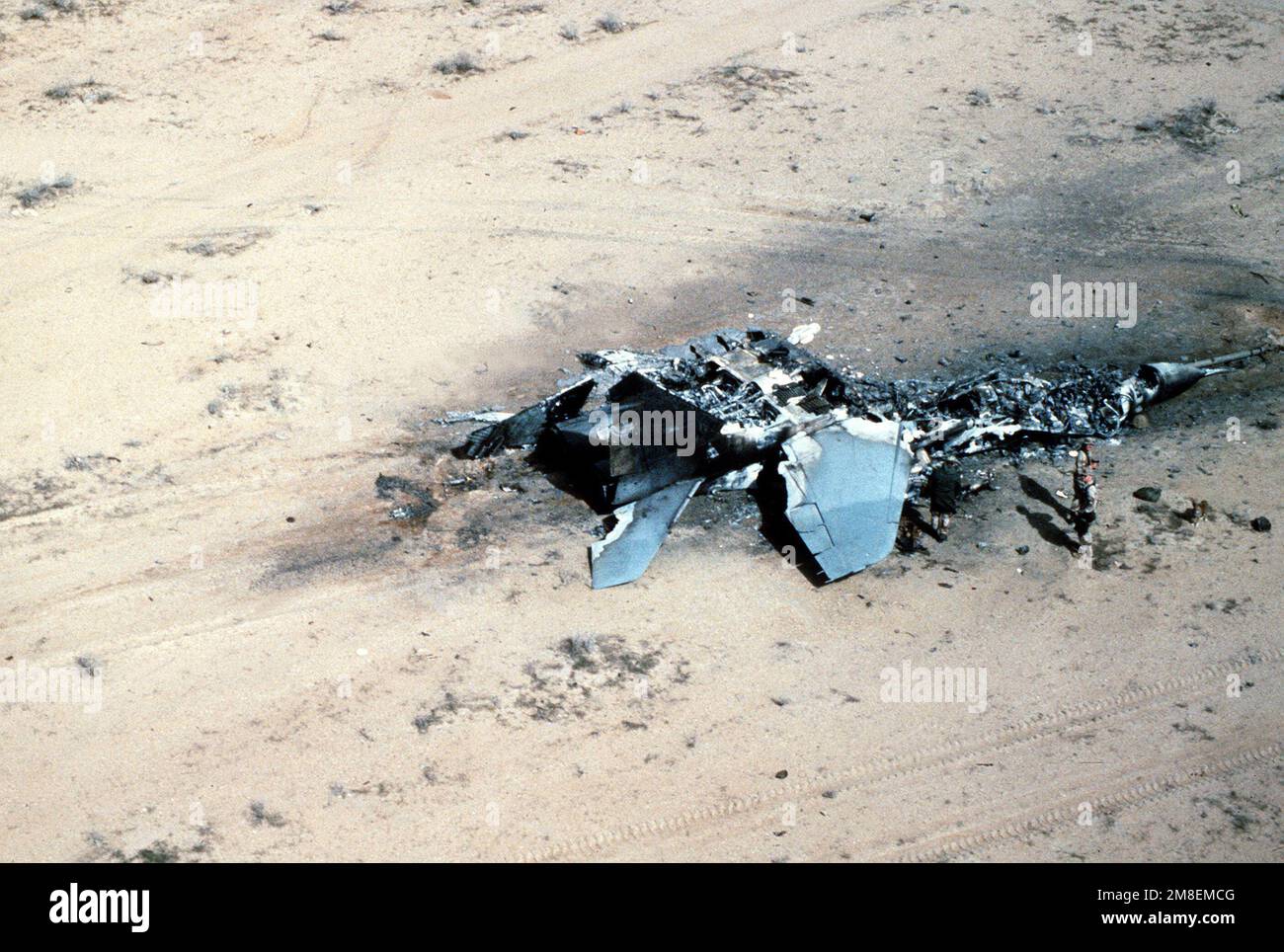 An Iraqi fighter jet lies in ruins in the aftermath of an Allied ...