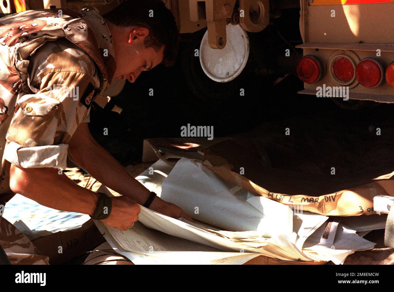 A member of the G-2 staff at the 2nd Marine Division combat operations ...