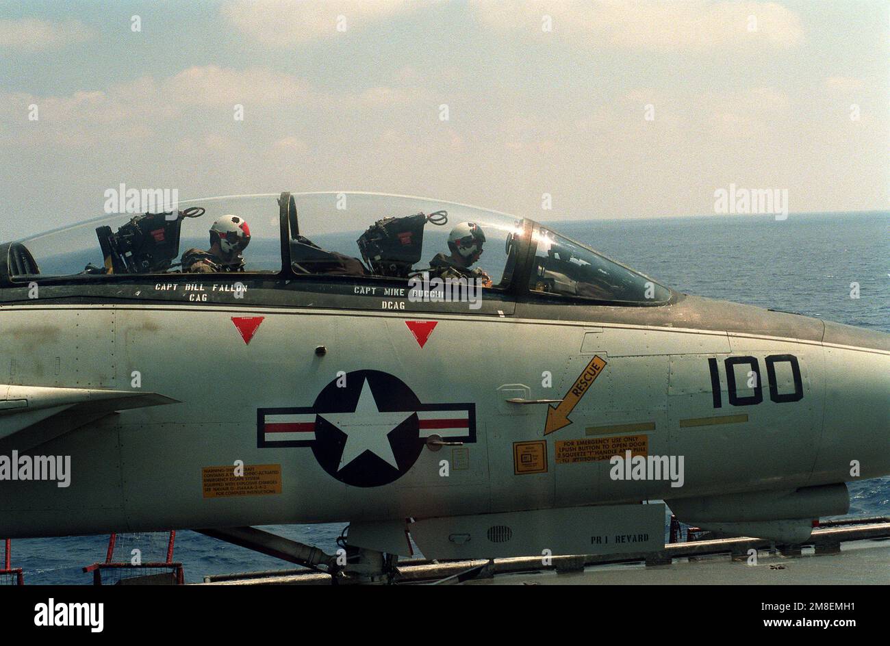 The pilot and Radar Intercept Officer (RIO) of a Fighter Squadron 41 (VF-41) F-14A Tomcat ...