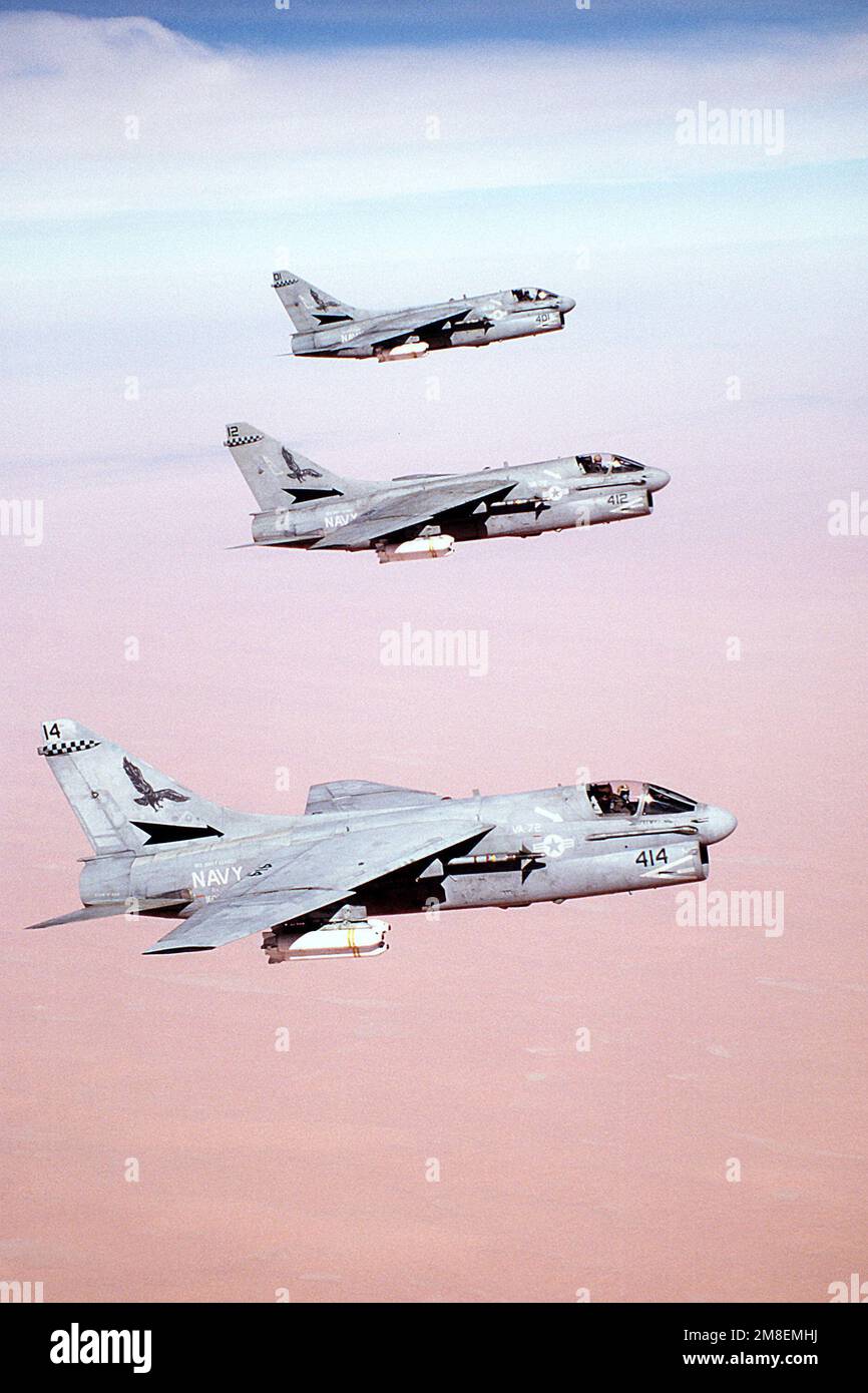 An air-to-air right side view of three Attack Squadron 72 (VA-72) A-7E ...