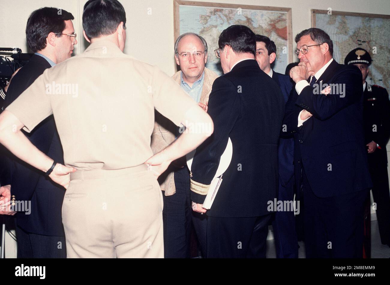 Officers and civilian officials speak with Secretary of Defense Richard ...