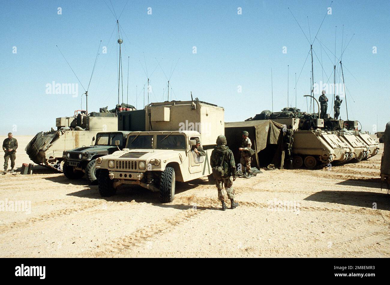 A soldier backs an M-998 high-mobility, multipurpose, wheeled vehicle ...
