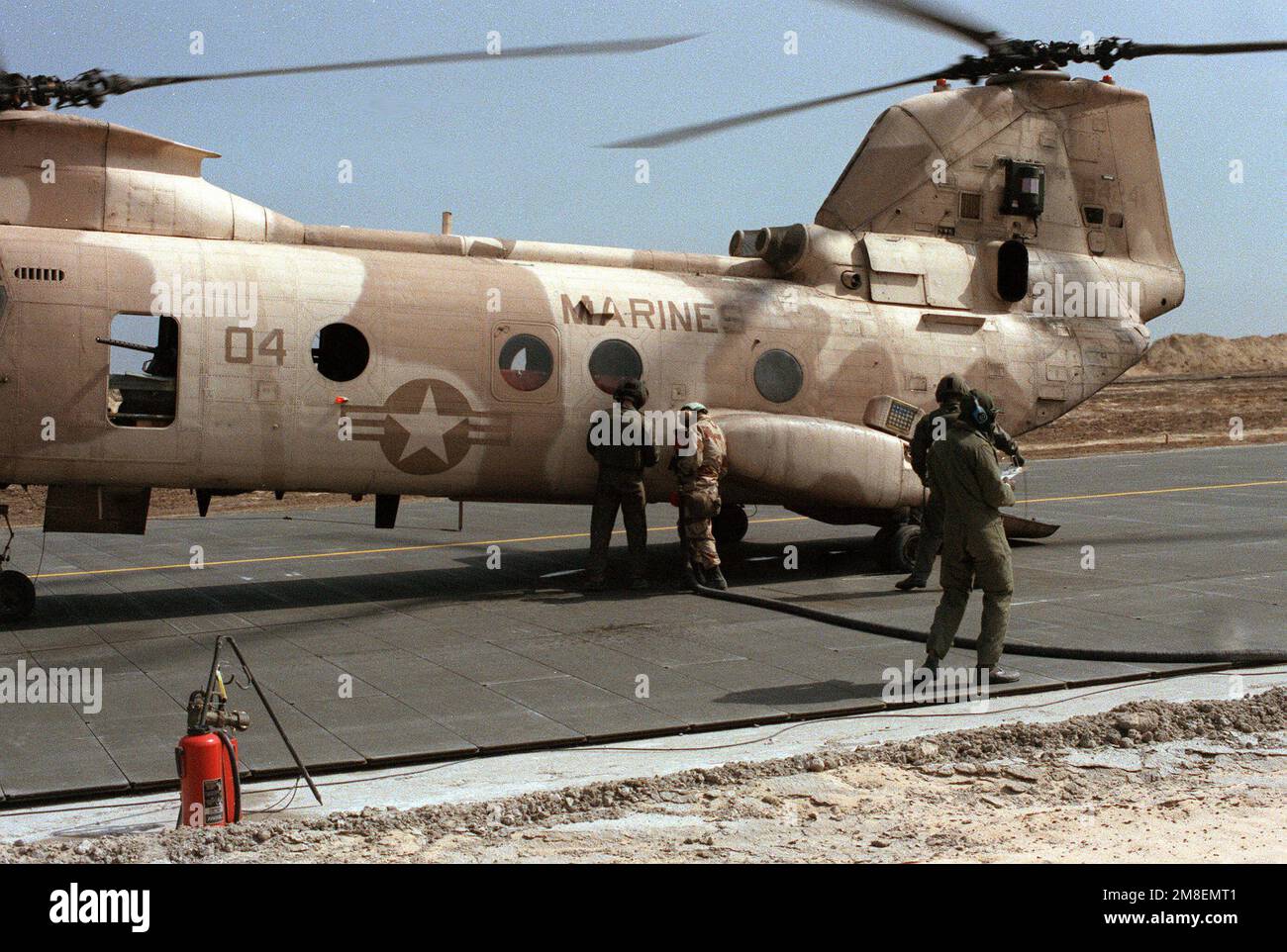The crew chief of a Marine Medium Helicopter Squadron 161 (HMM-161) CH ...