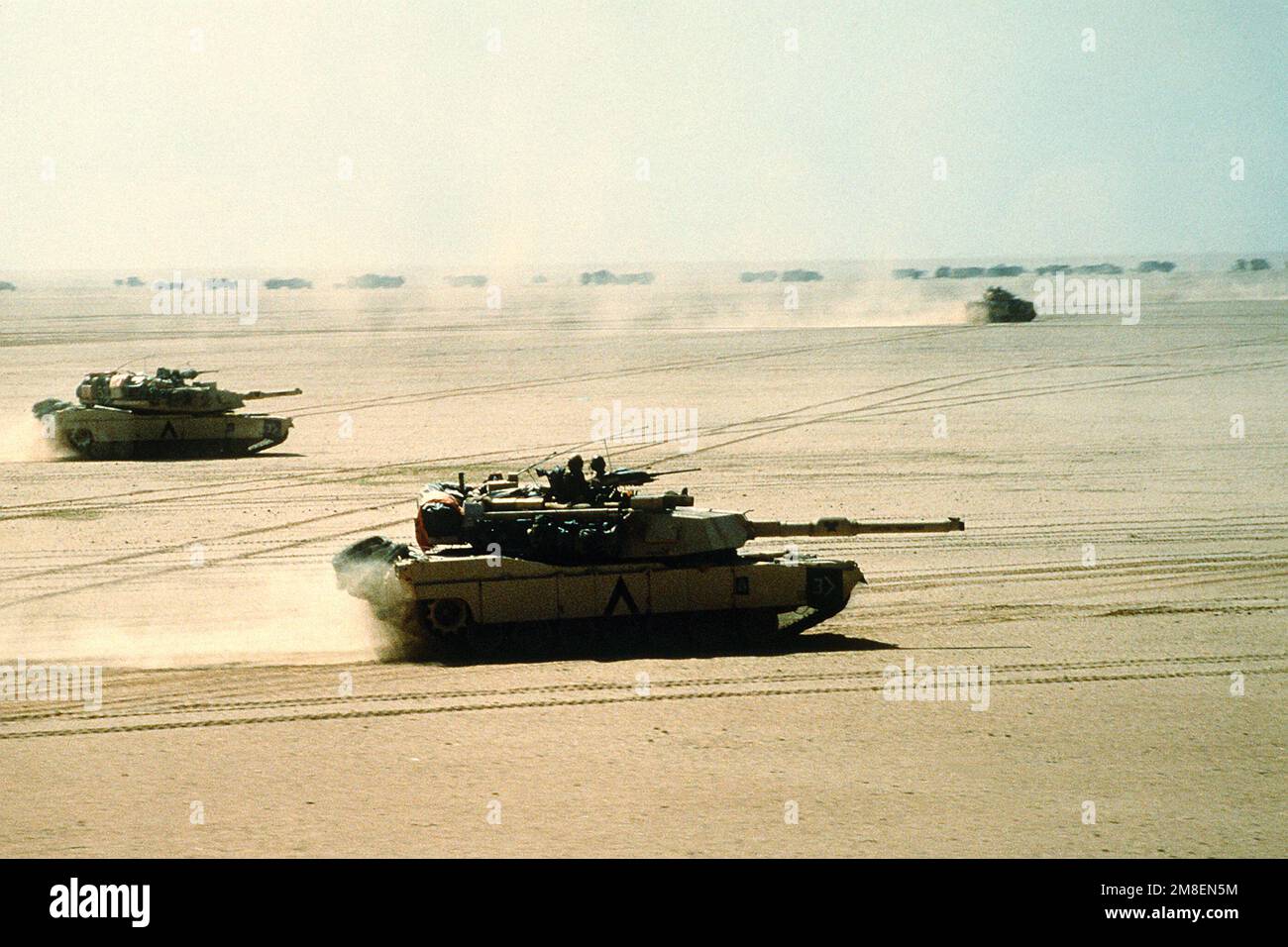 M-1A1 Abrams main battle tanks of the 3rd Armored Division move out on ...