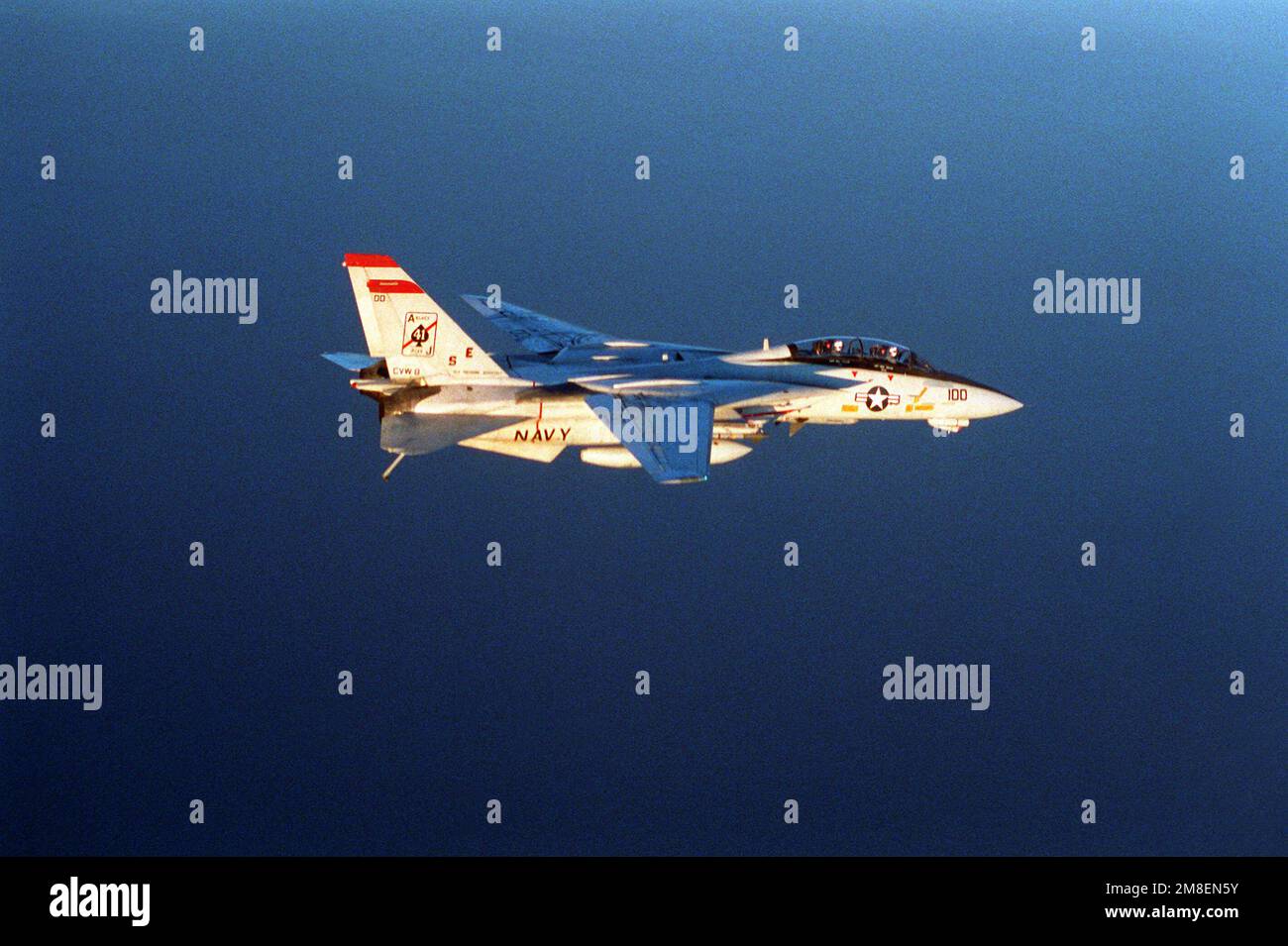 Light from the setting sun shines on a Fighter Squadron 41 (VF-41) F ...