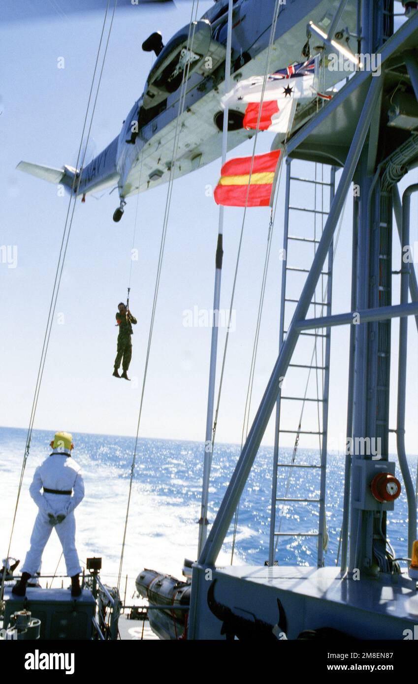 A Westland Sea King helicopter of the Royal Australian Navy picks up a ...