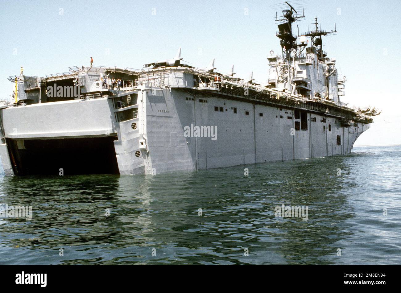 The amphibious assault ship USS NASSAU (LHA-4) lies at anchor with its ...
