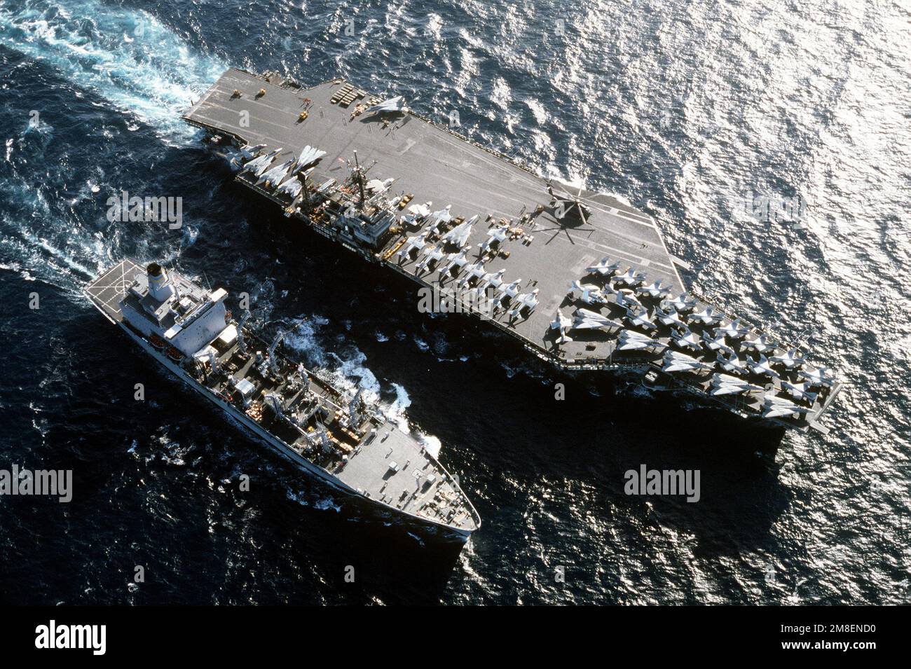 The aircraft carrier USS JOHN F. KENNEDY (CV-67) comes alongside the ...