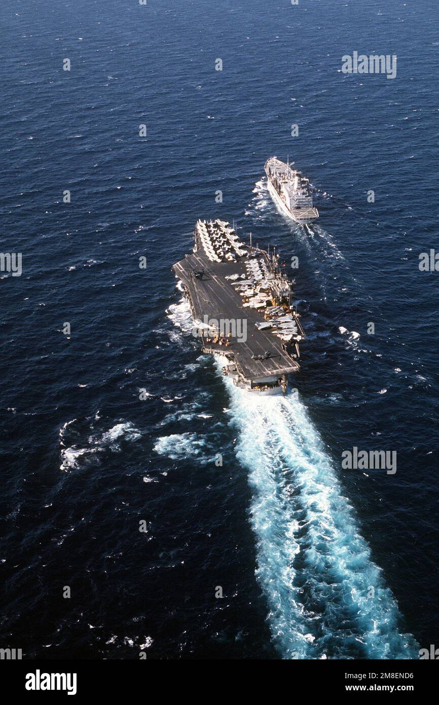 The aircraft carrier USS JOHN F. KENNEDY (CV-67) approaches the oiler ...